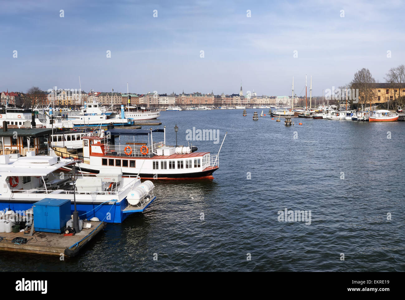View of downtown Stockholm canal with commercial small boat docks near ...