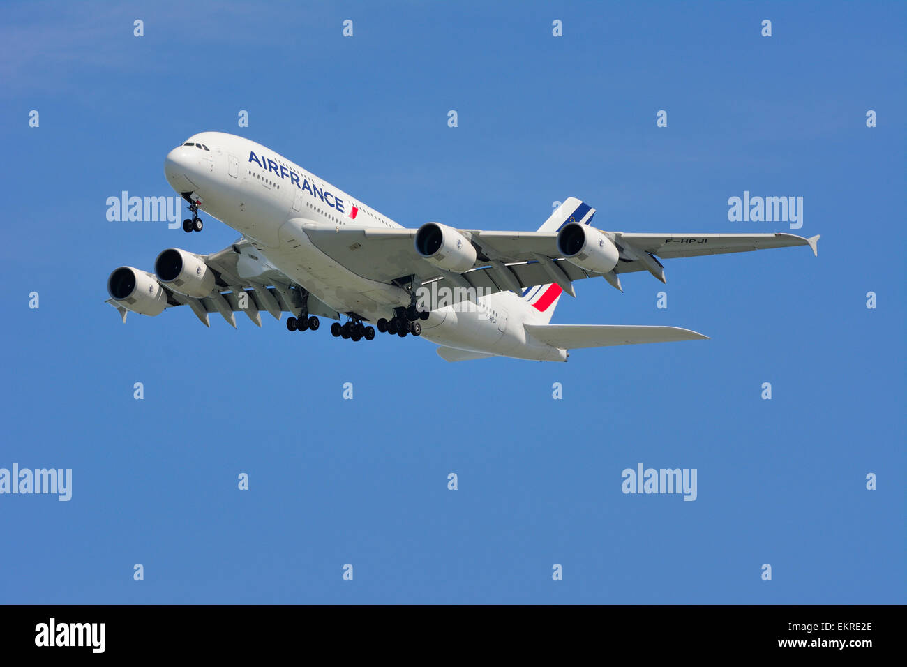 An Air France Airbus A380 climbs through a clear blue sky, showing its ...