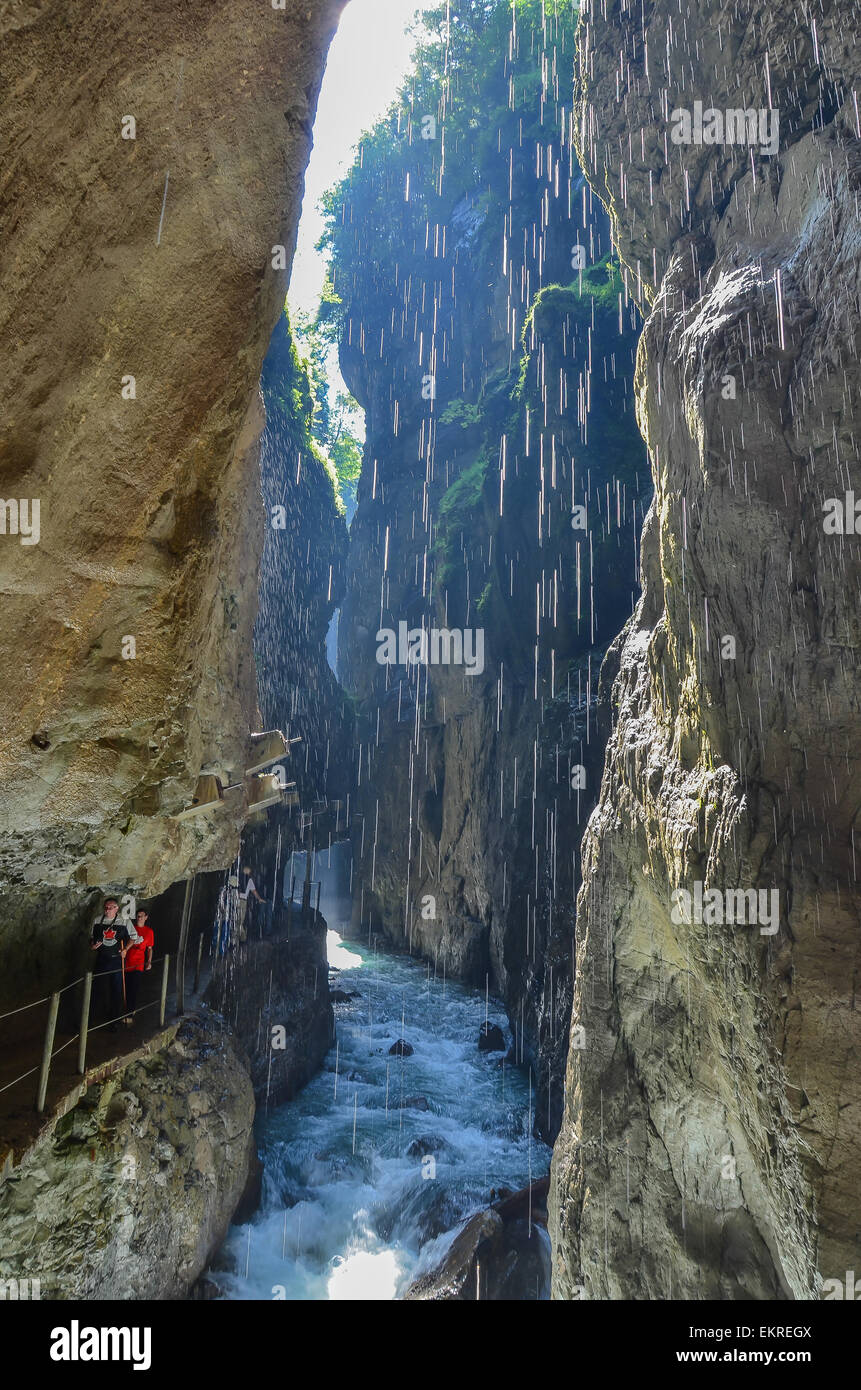 A torrential mountain river is gushing through the Partnach Gorge ...