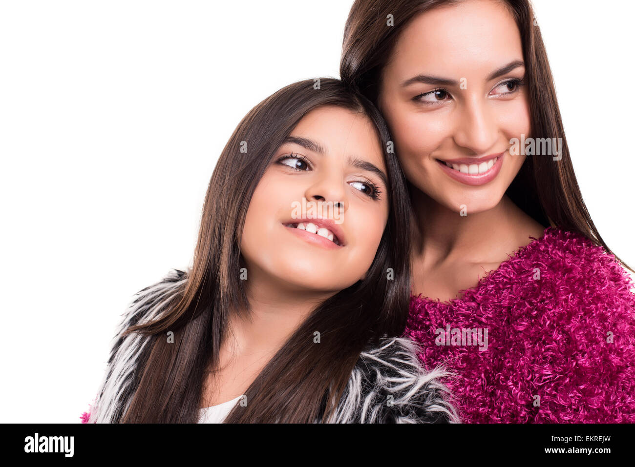 Fashion woman and girl posing over white background Stock Photo - Alamy