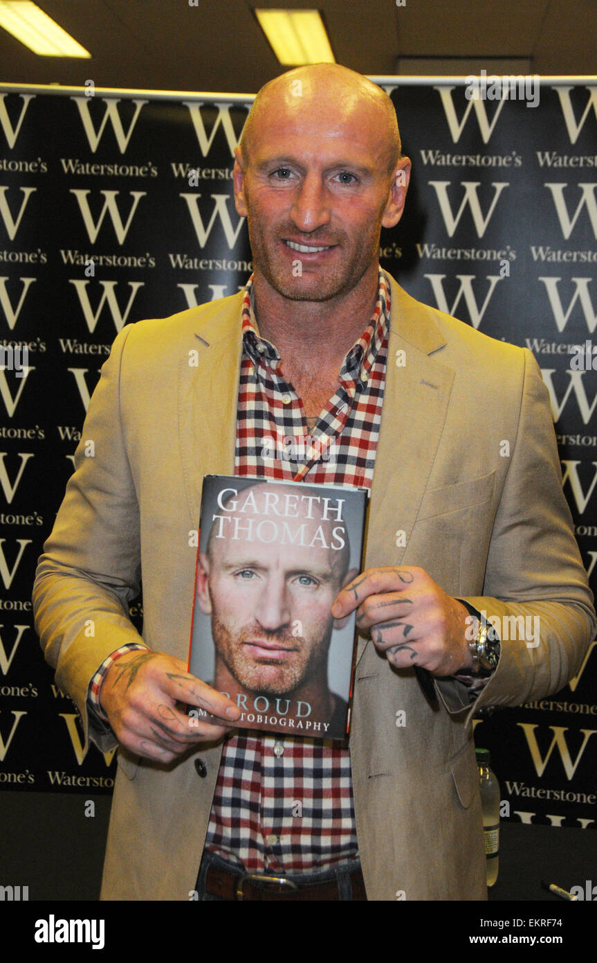 London, UK, 24 October 2014, Welsh rugby player Gareth Thomas signs ...