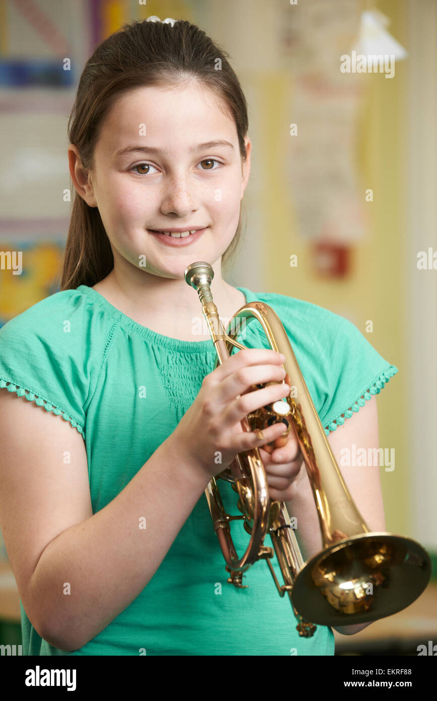 Girl Learning To Play Trumpet In School Music Lesson Stock Photo - Alamy