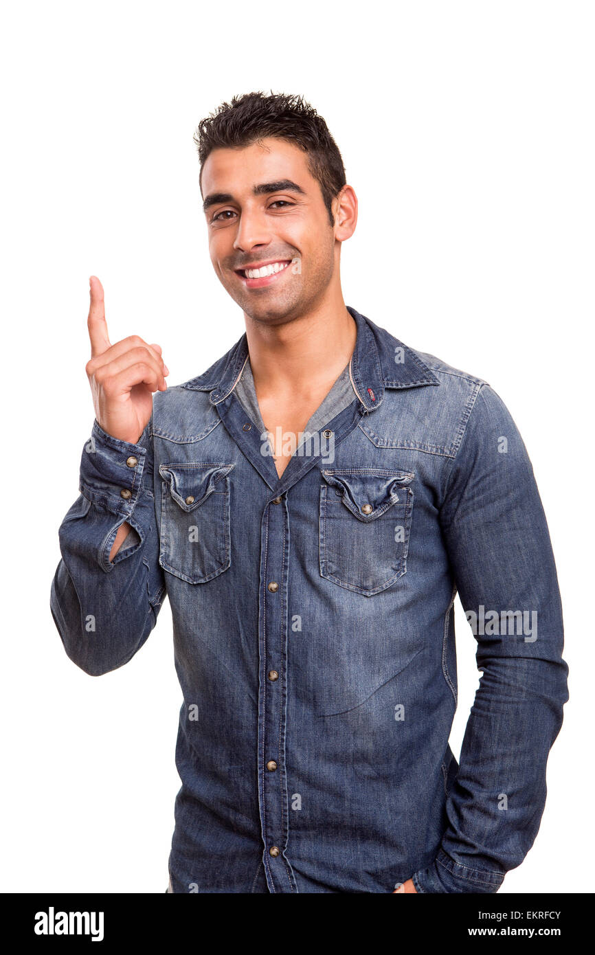 Portrait of a smiling young man pointing up Stock Photo - Alamy