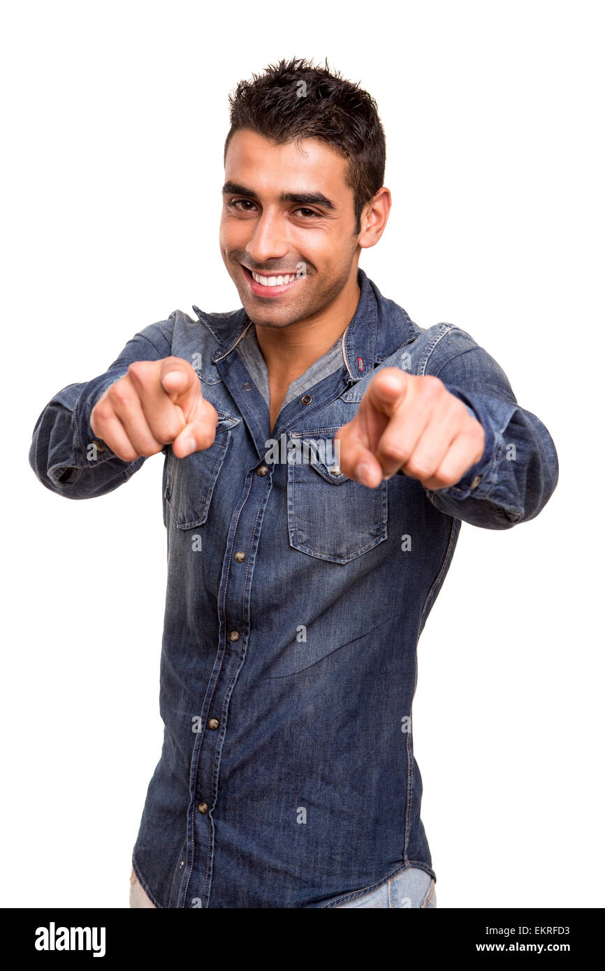 Portrait of a smiling young man pointing front Stock Photo - Alamy