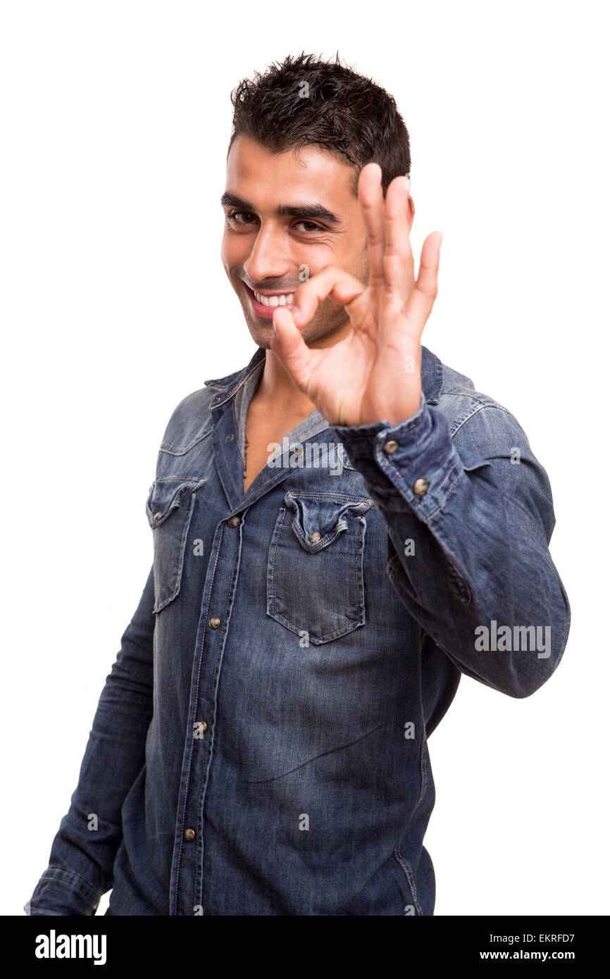 Portrait of a young man showing Ok sign Stock Photo - Alamy
