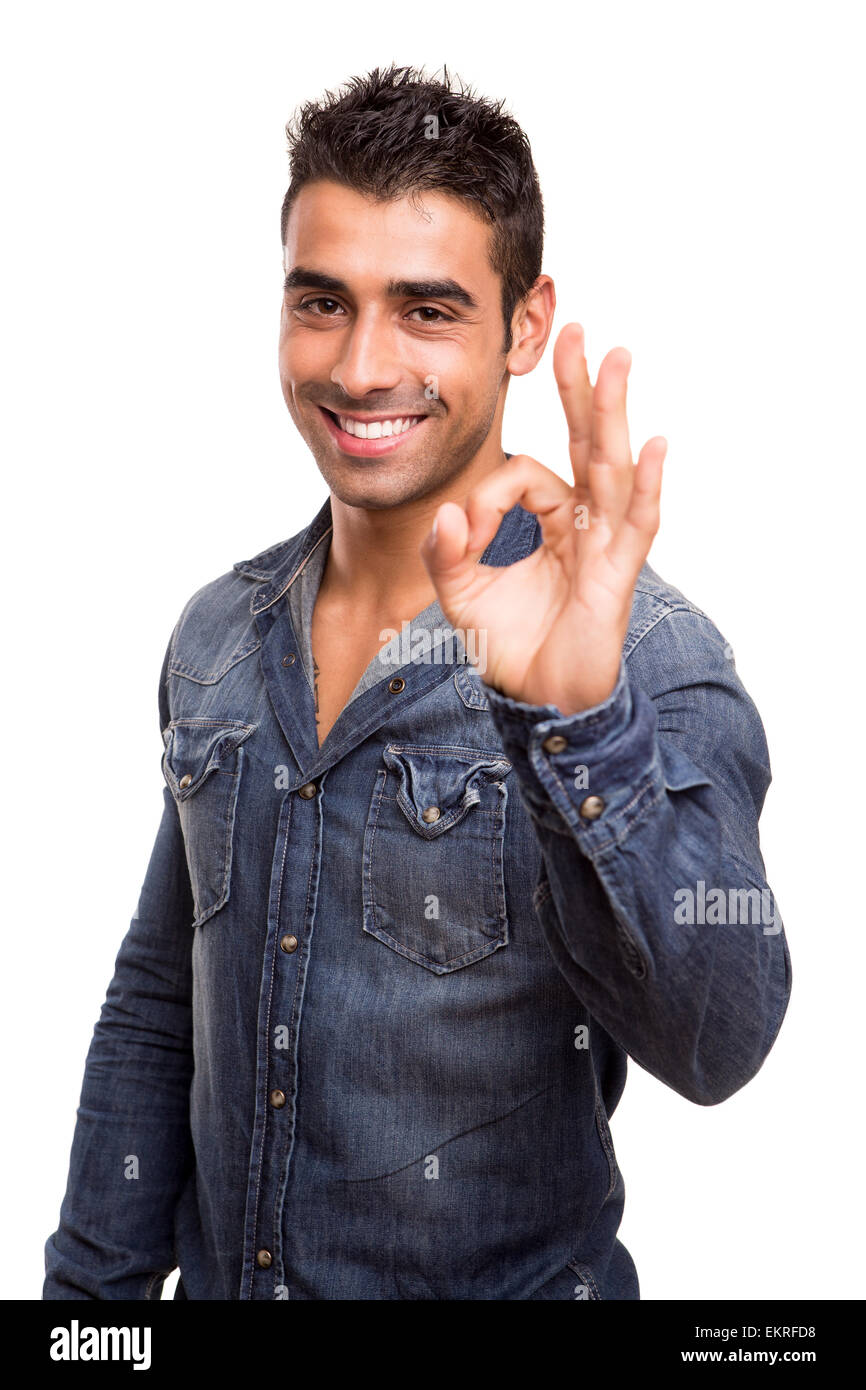 Portrait of a young man showing Ok sign Stock Photo - Alamy