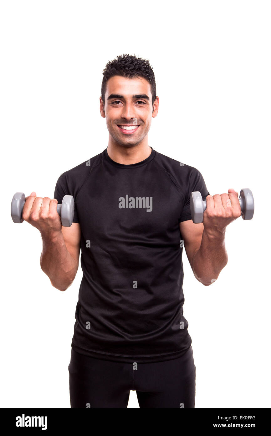 Smiling man lifting weights over white background Stock Photo - Alamy