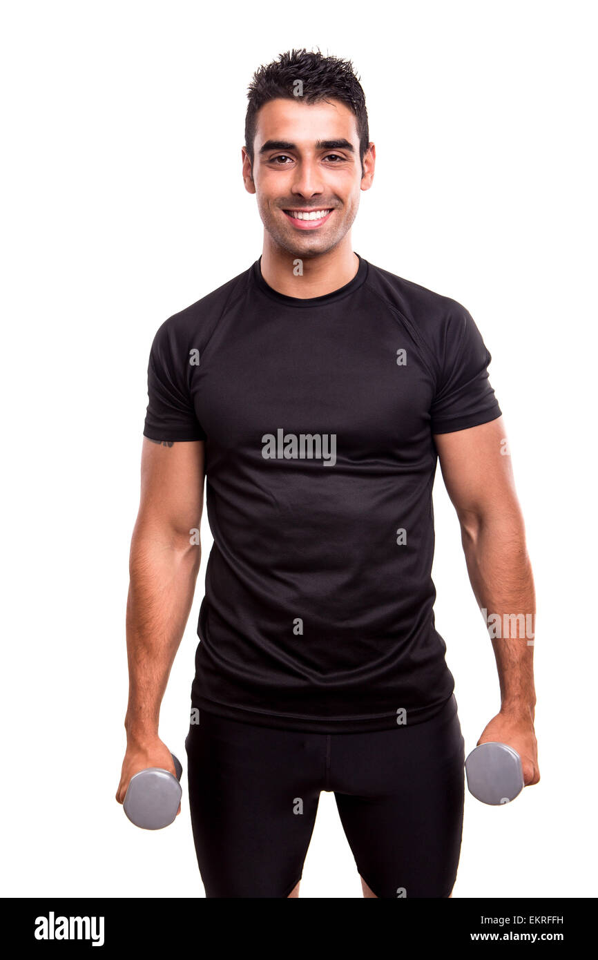 Smiling man lifting weights over white background Stock Photo - Alamy