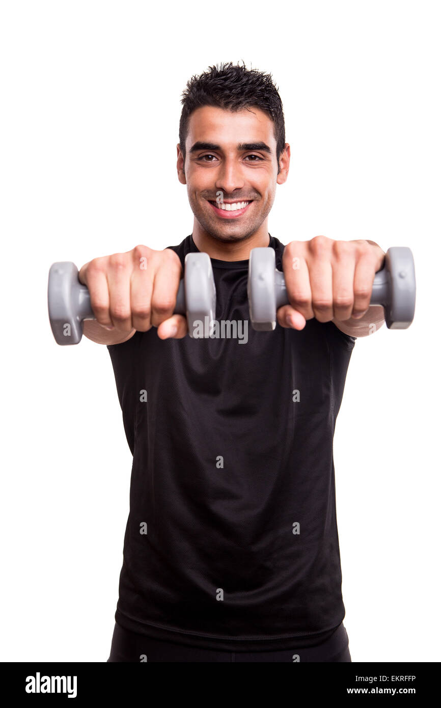 Smiling man lifting weights over white background Stock Photo - Alamy