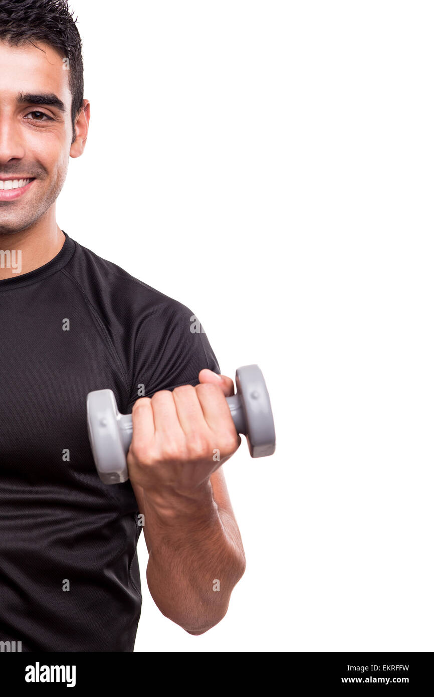 Smiling man lifting weights over white background Stock Photo - Alamy