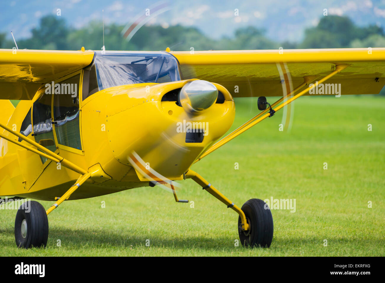 Yellow airplane on grass; Locarno, Ticino, Switzerland Stock Photo - Alamy