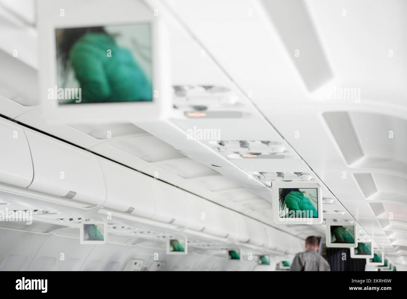 Passengers and staff crew in the plane cabin Stock Photo - Alamy
