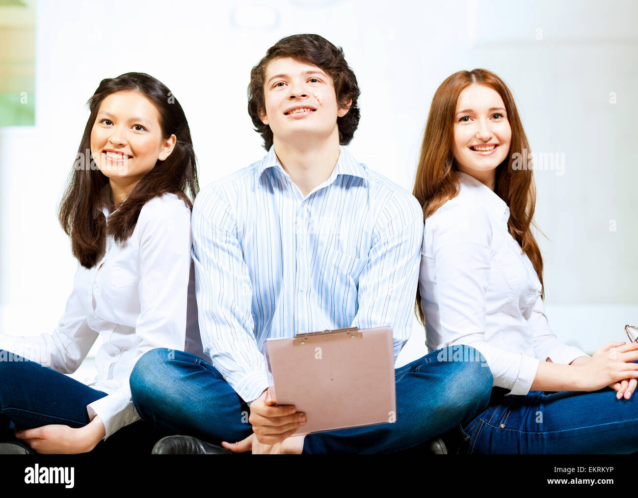 Three students smiling Stock Photo - Alamy