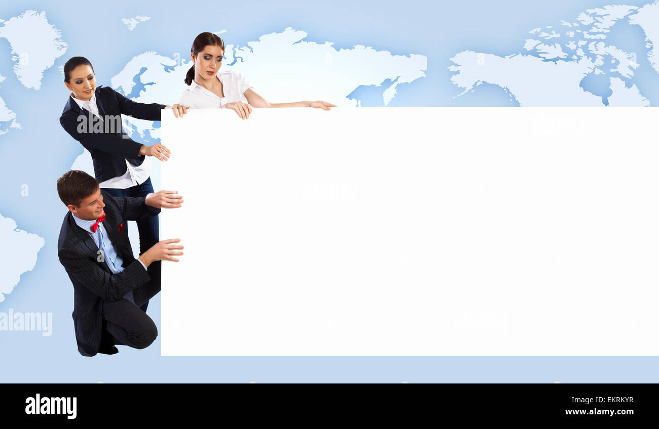 Three young people holding banner Stock Photo - Alamy