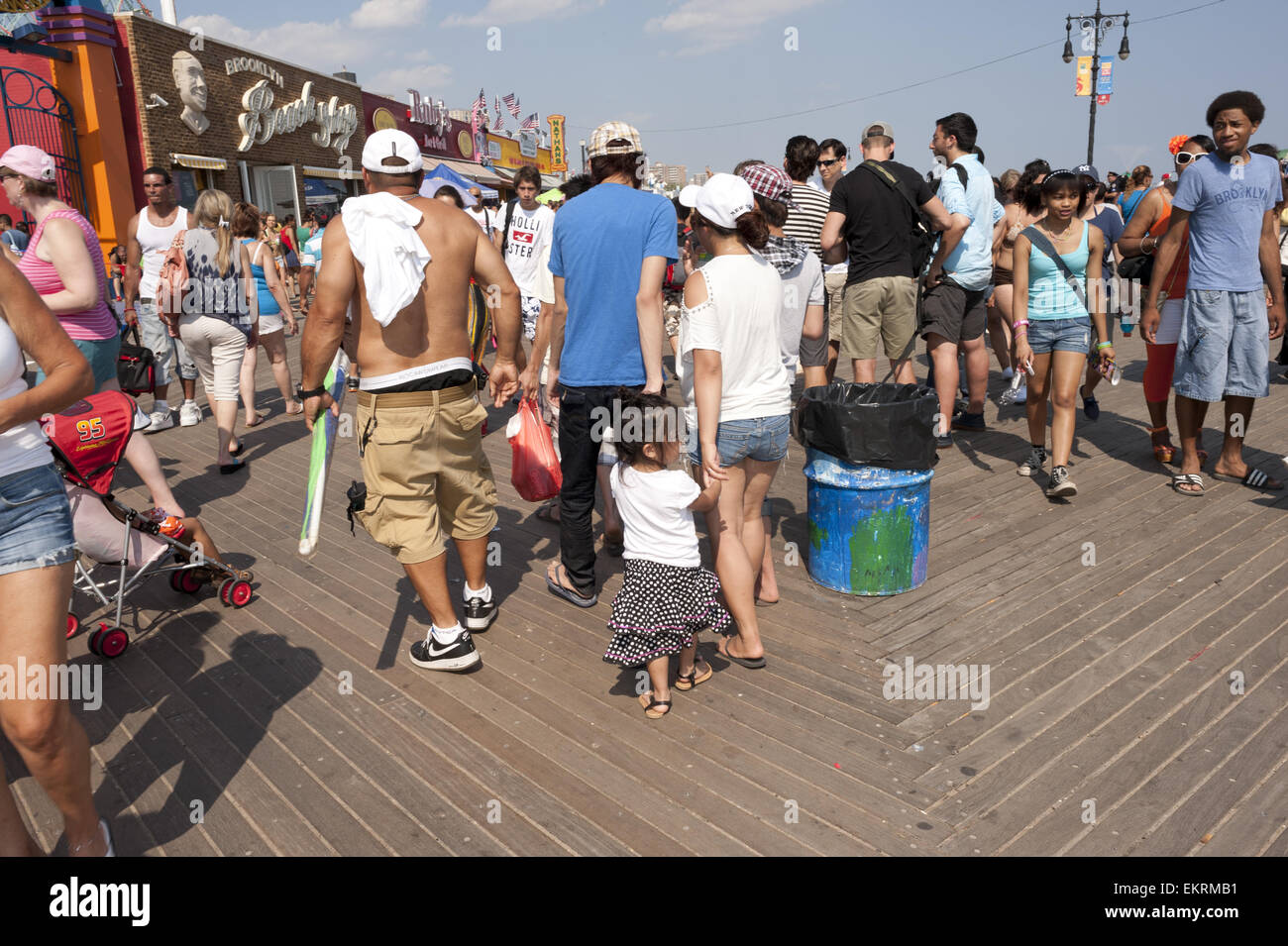 Crowds line the boardwalk at Coney Island in Brooklyn, NY on the 4th of ...