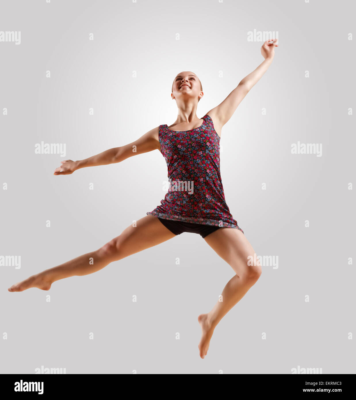 Girl in color dress dancing Stock Photo - Alamy