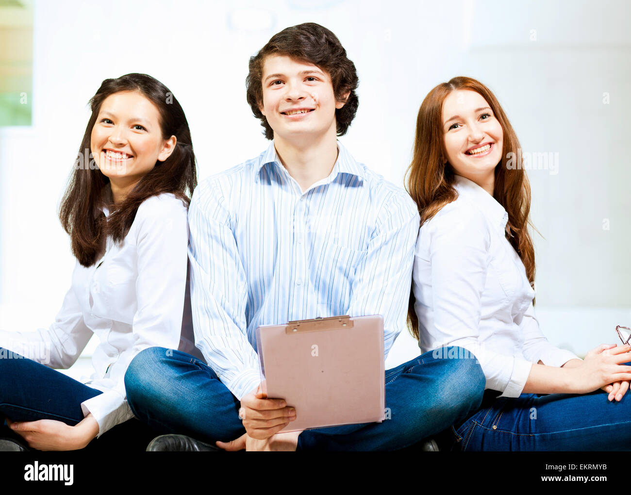 Three students smiling Stock Photo - Alamy