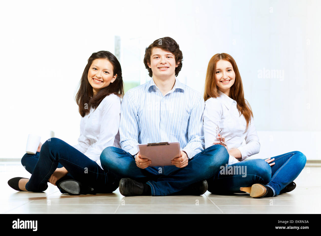 Three students smiling Stock Photo - Alamy