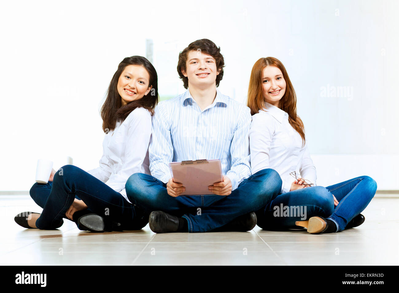 Three students smiling Stock Photo - Alamy