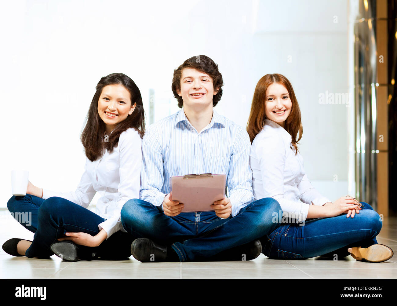 Three students smiling Stock Photo - Alamy