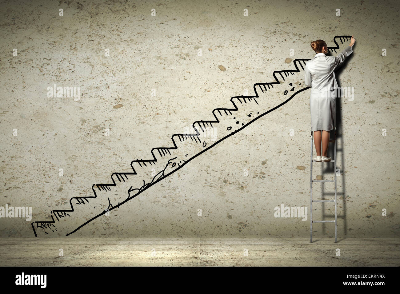 Woman standing on ladder Stock Photo - Alamy