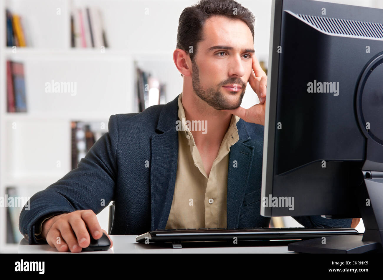 Man Looking At A Computer Monitor Stock Photo - Alamy
