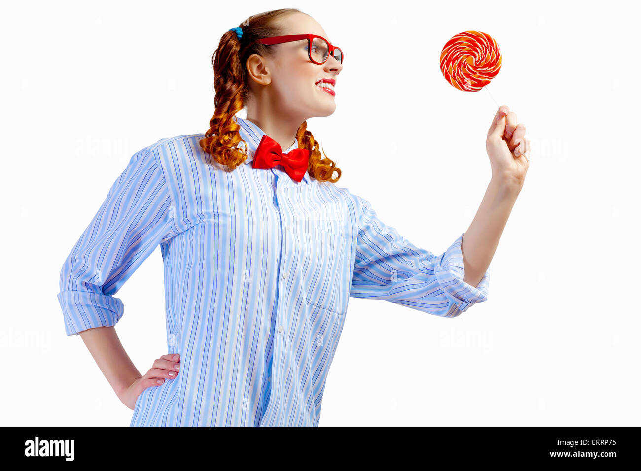 Young woman holding candy Stock Photo - Alamy