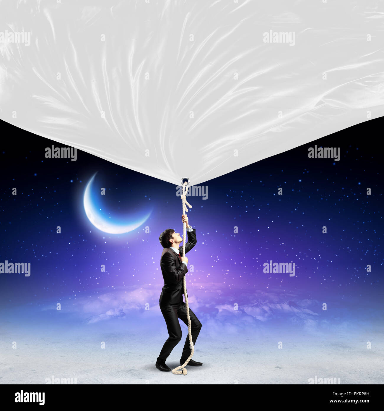 Businessman pulling banner Stock Photo - Alamy