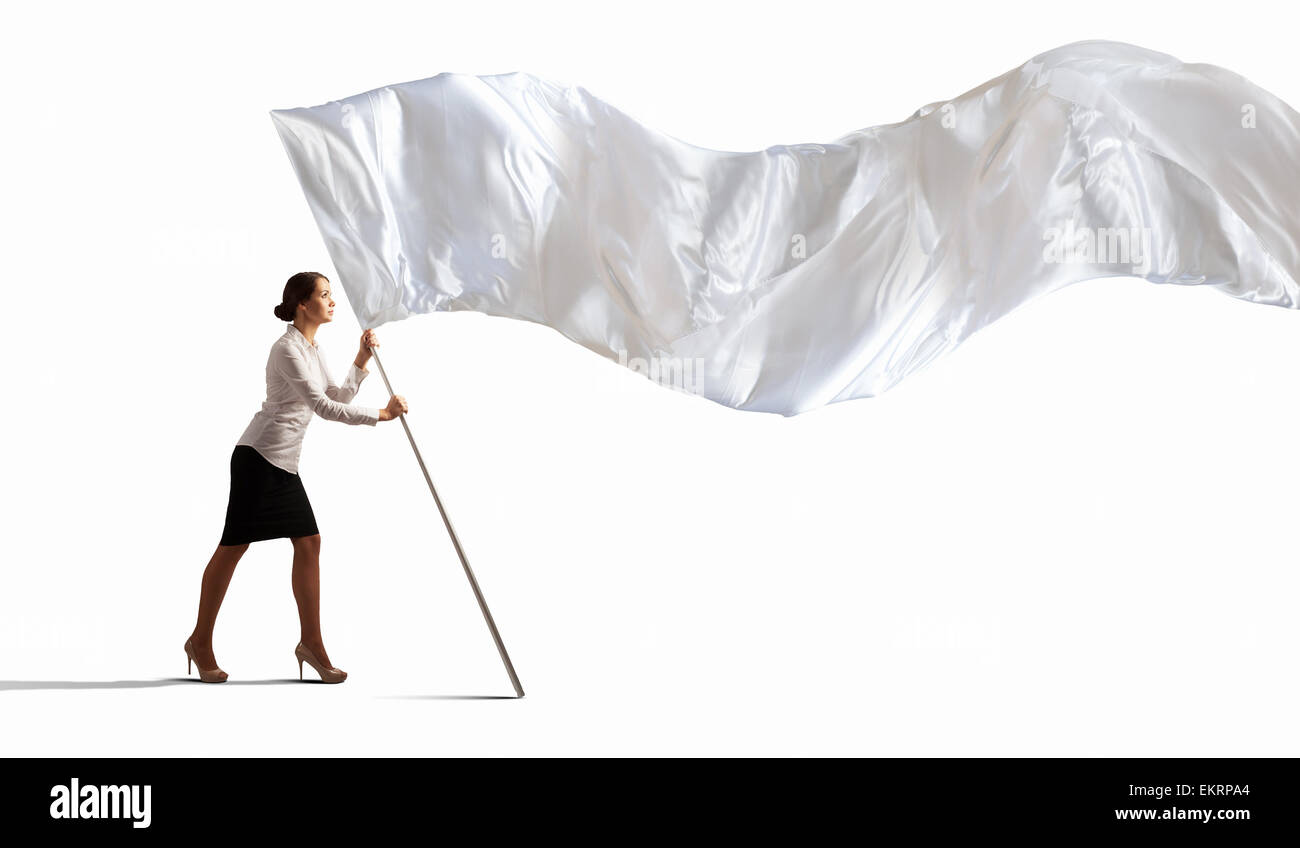 Businesswoman holding white flag Stock Photo - Alamy