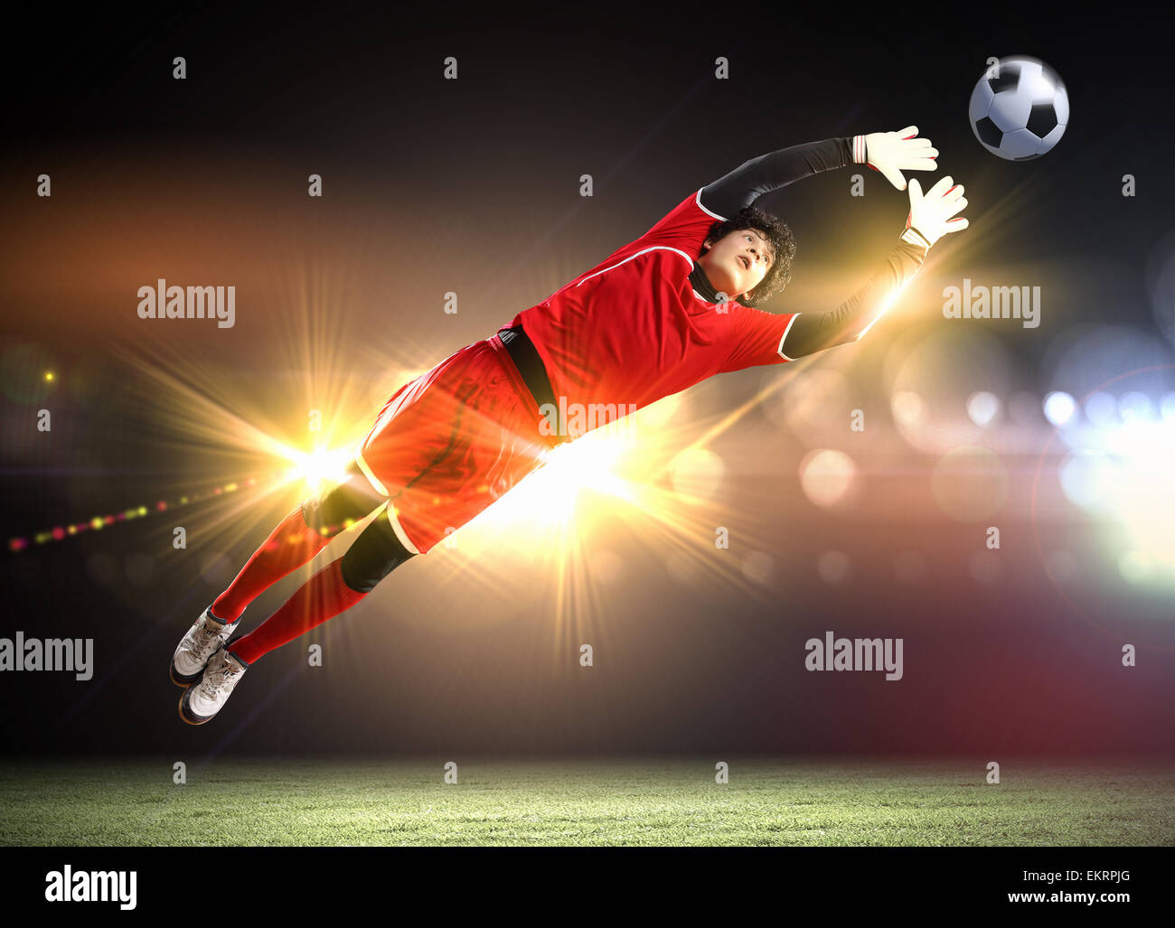 Goalkeeper catches the ball Stock Photo - Alamy