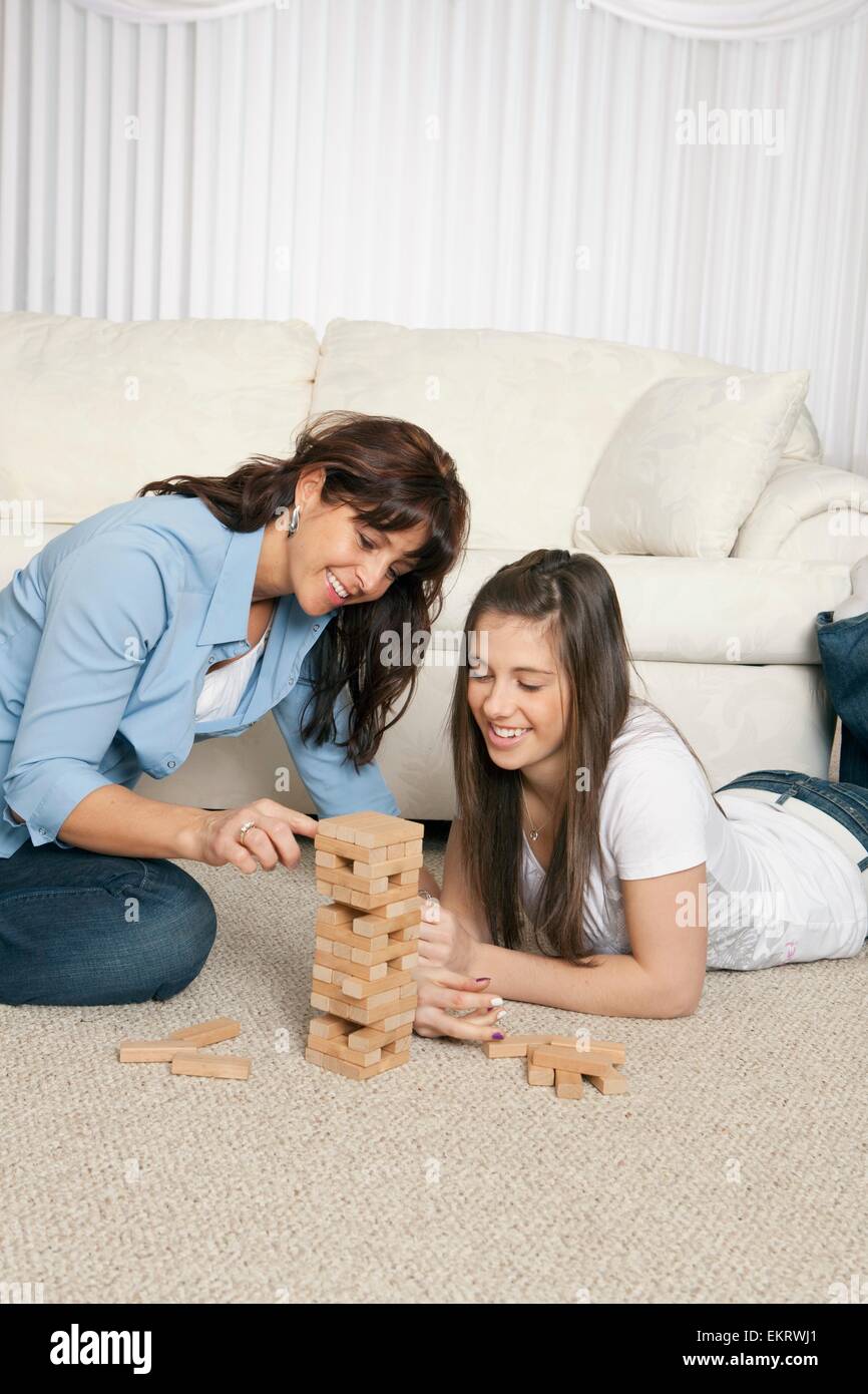 Two Girls Playing A Stacking Block Game Stock Photo - Alamy