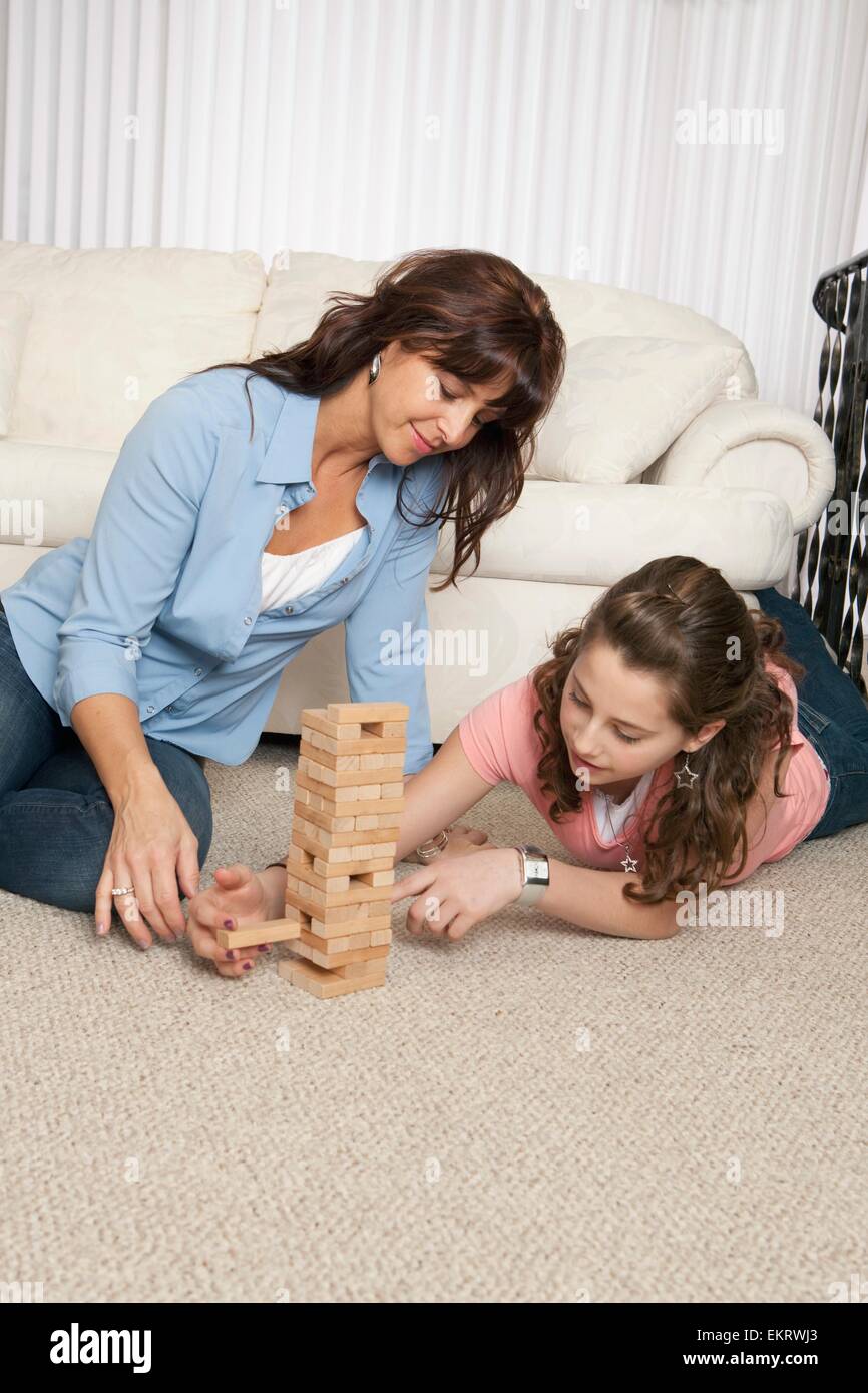 Two Girls Playing A Stacking Block Game Stock Photo - Alamy