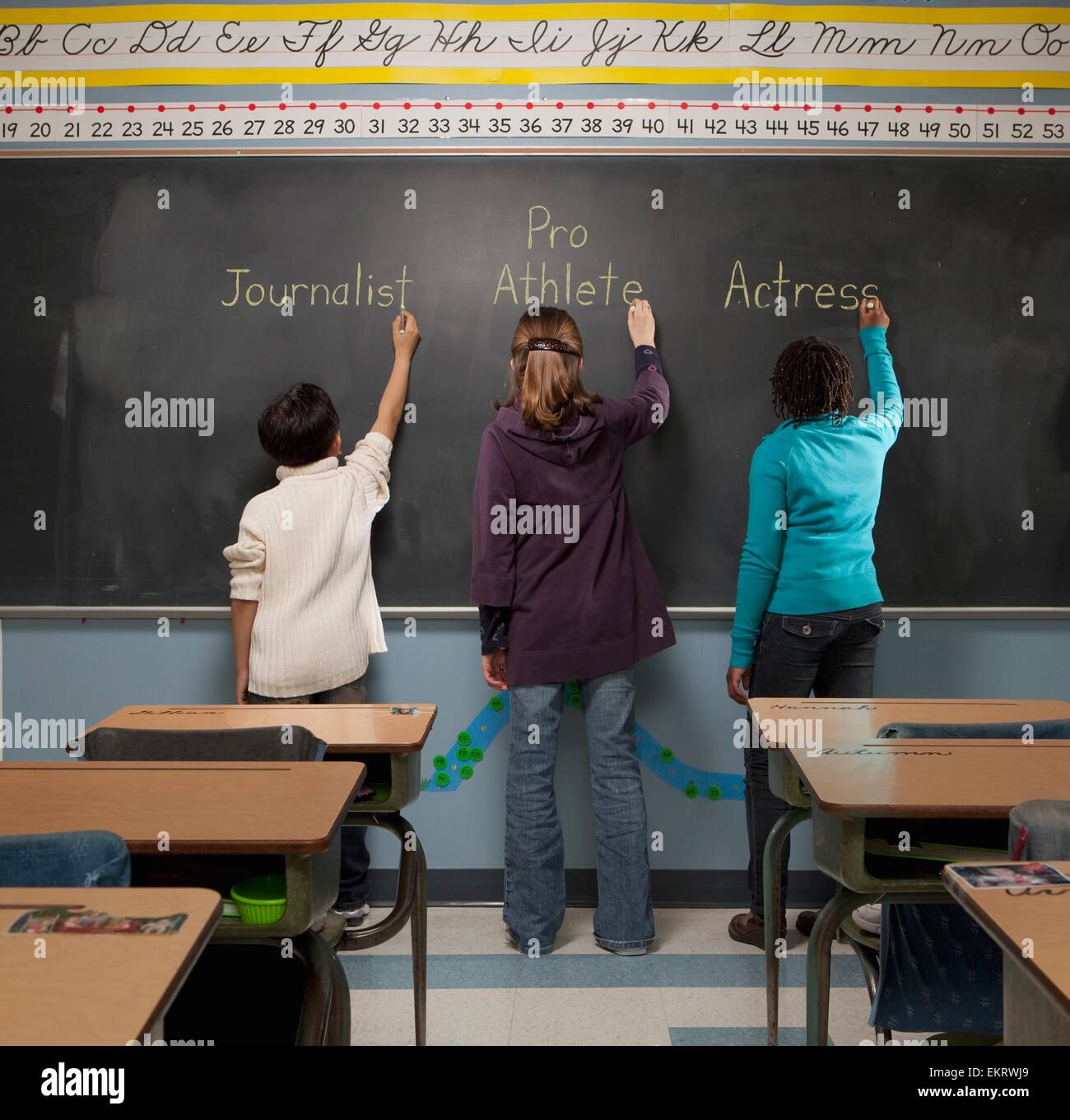 Children Writing Their Future Careers On Blackboard Stock Photo - Alamy
