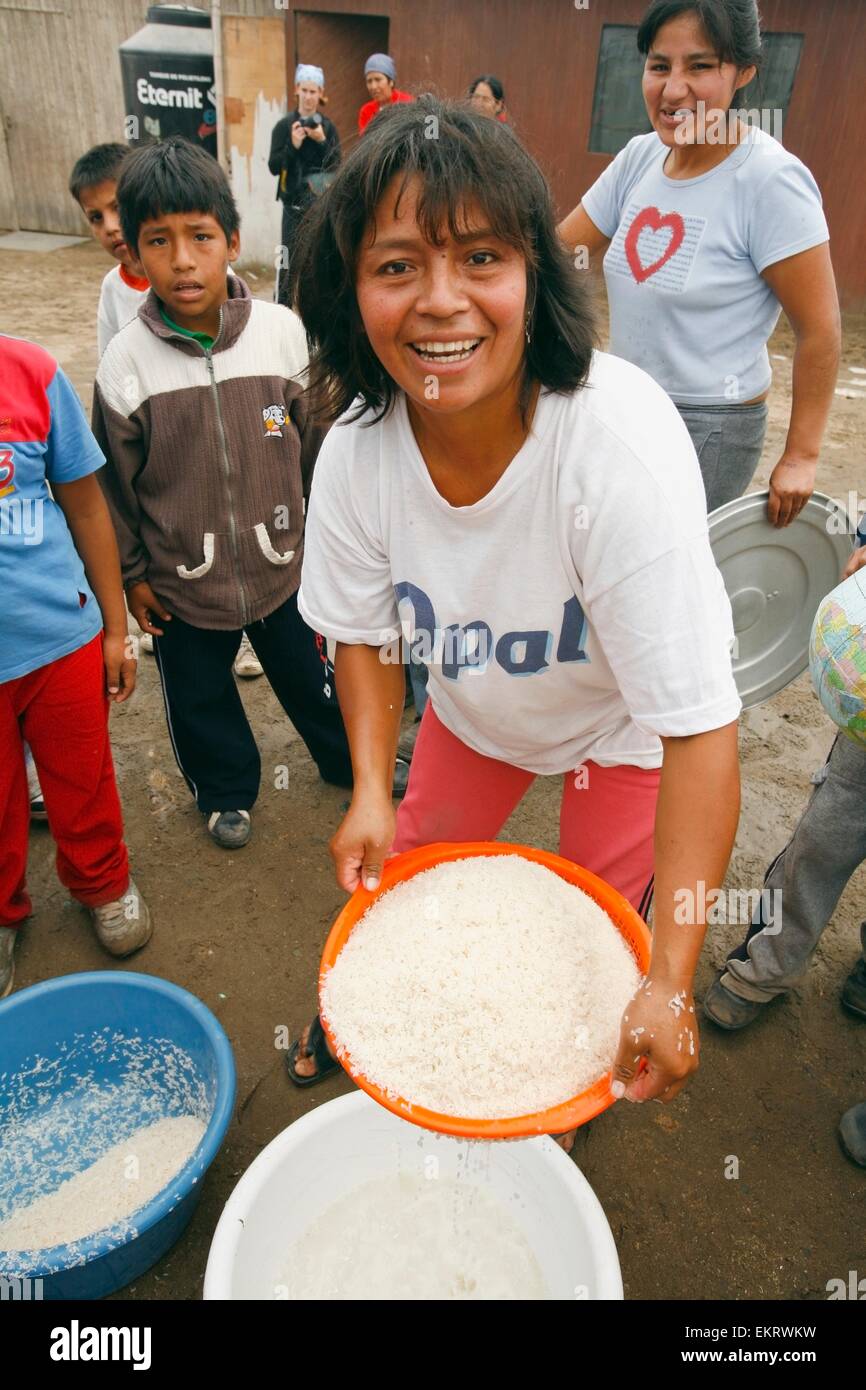 Woman With Pan Of Rice, Lima, Peru Stock Photo - Alamy