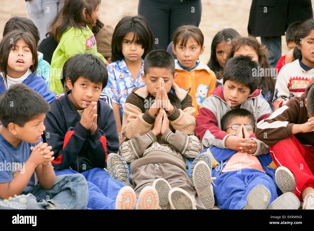 Group Of Young Children Praying, Lima, Peru Stock Photo - Alamy