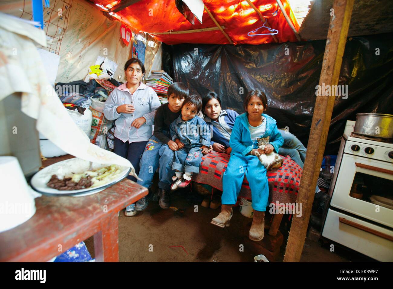 Family In Poverty Stricken Dwelling, Lima, Peru Stock Photo - Alamy