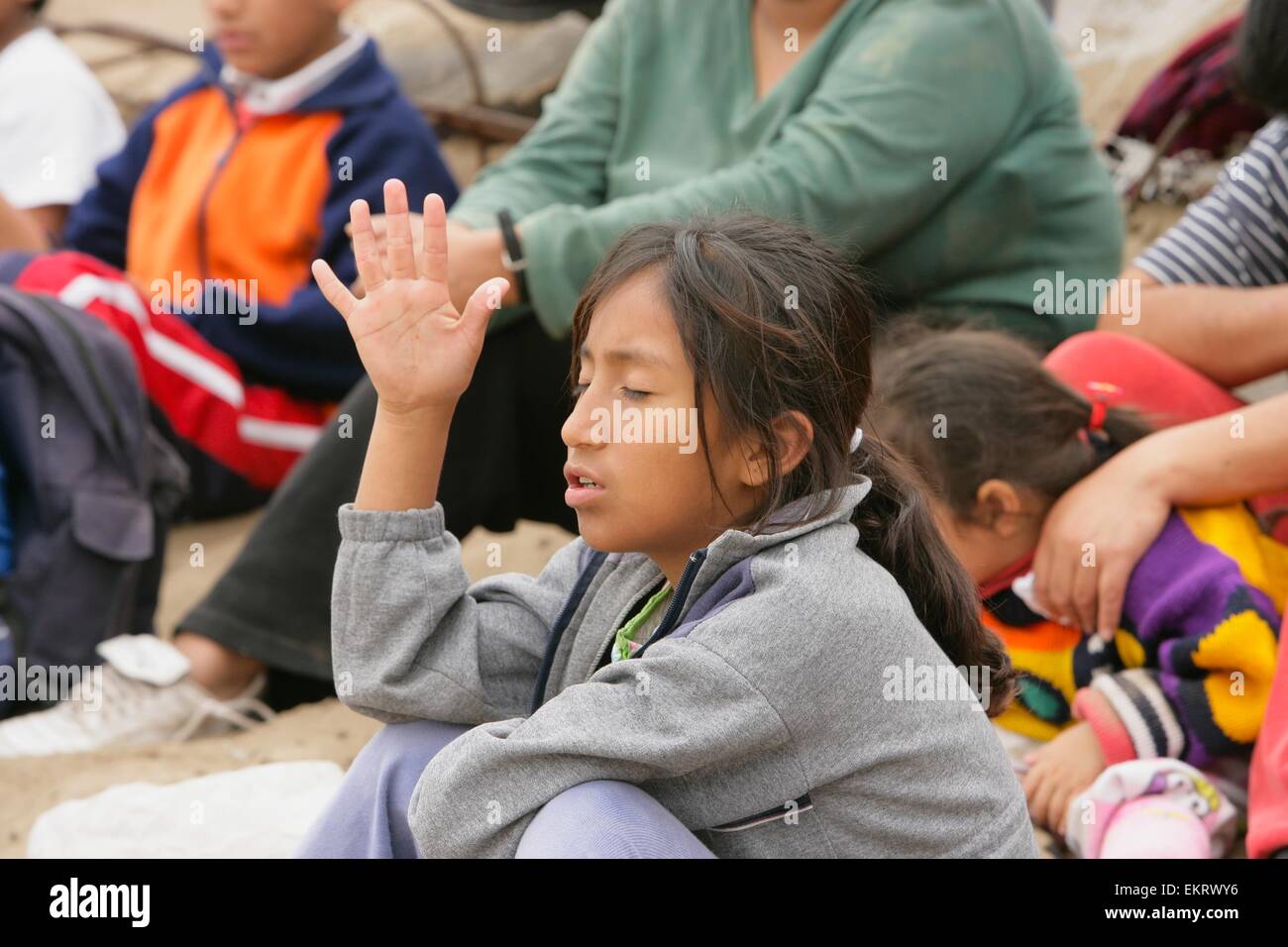 Young Girl Raising Hand, Lima, Peru Stock Photo - Alamy