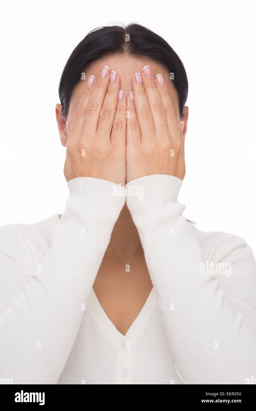 Woman closed face with hands Stock Photo - Alamy