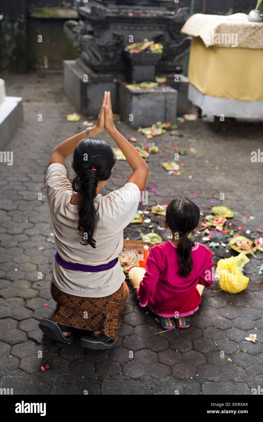 Woman And Child Praying; Bali, Indonesia Stock Photo - Alamy