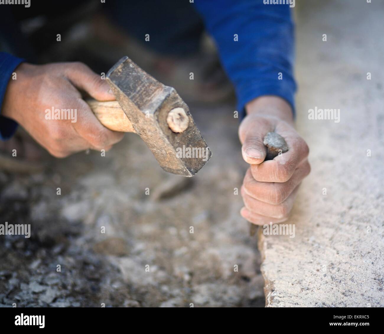Man Working With A Hammer And Chisel; Kashmir, India Stock Photo - Alamy