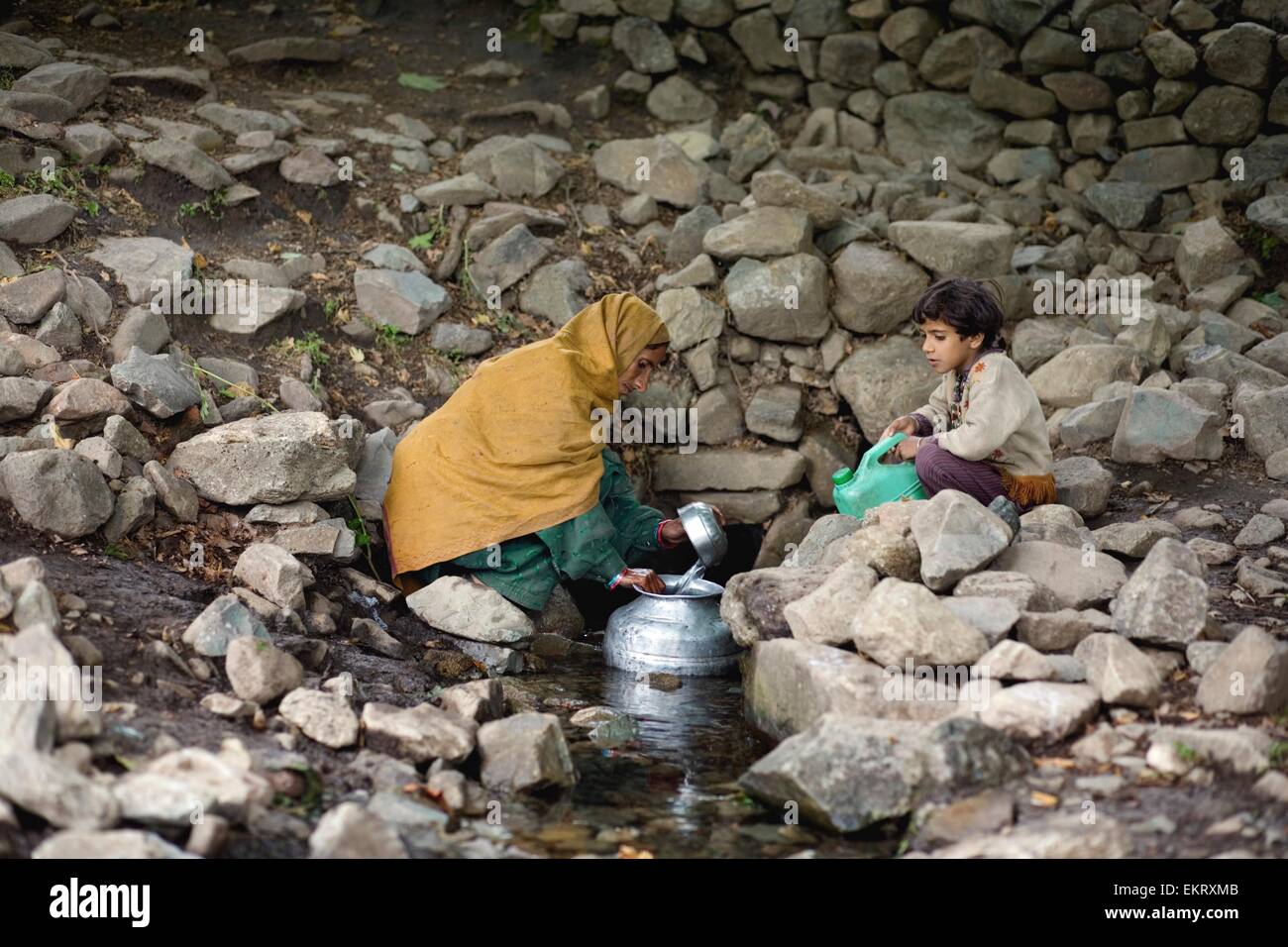 Woman Fetching Water Stock Photo - Alamy