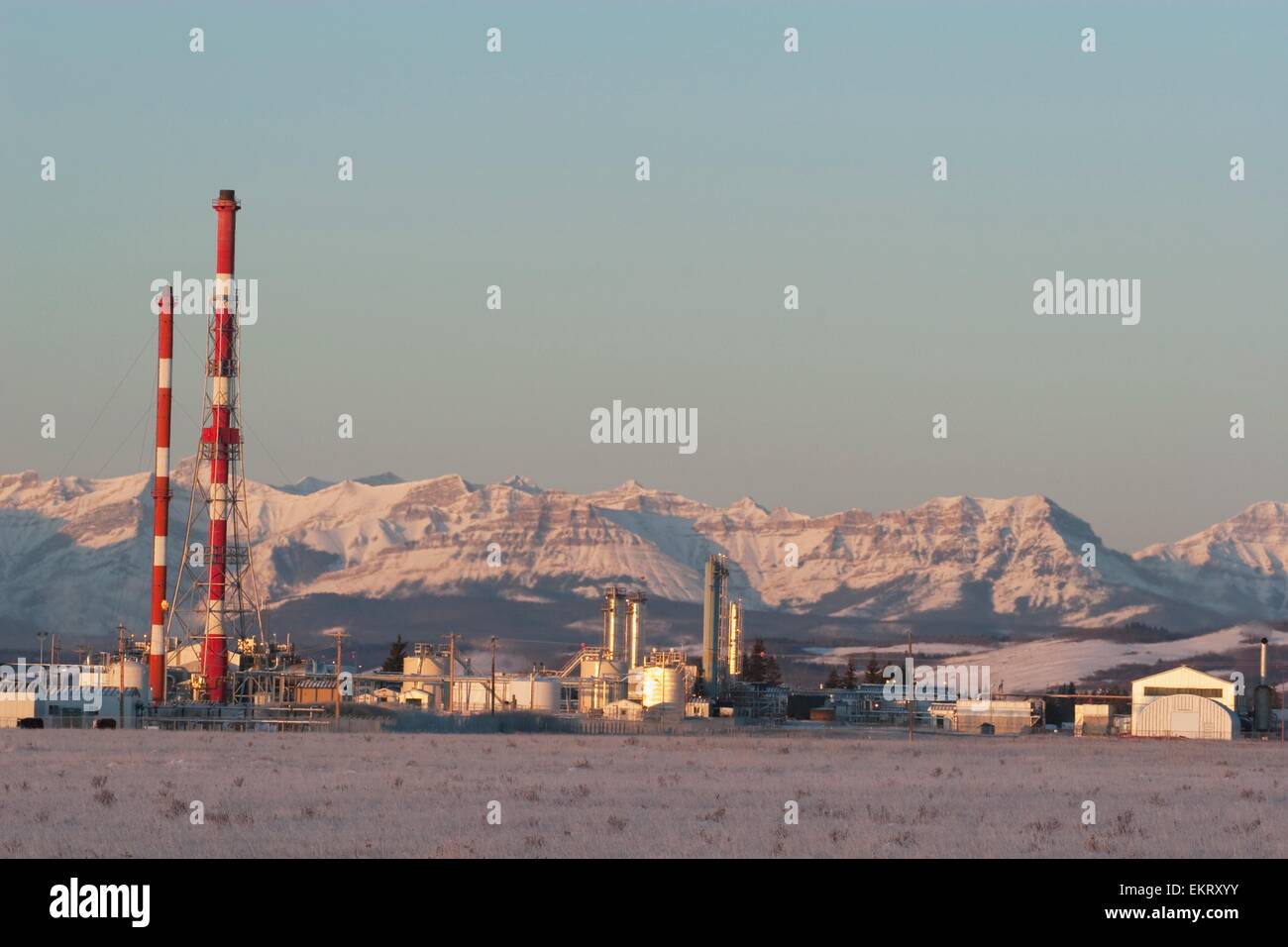 Gas Plant With Mountain Backdrop, Alberta, Canada Stock Photo - Alamy