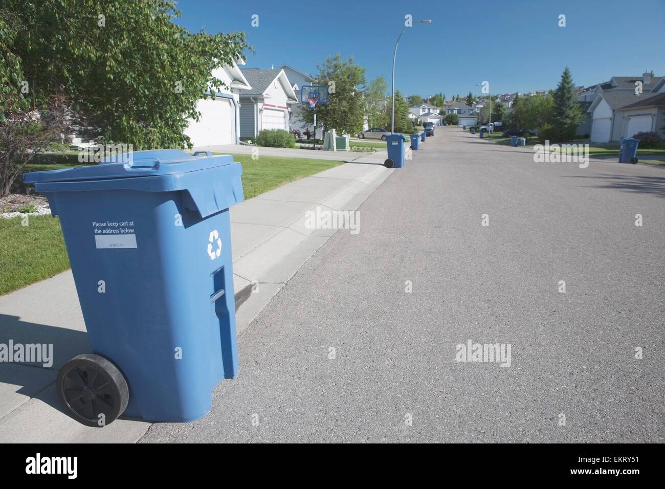 Recycling Bin On The Curb In A Neighborhood Stock Photo - Alamy