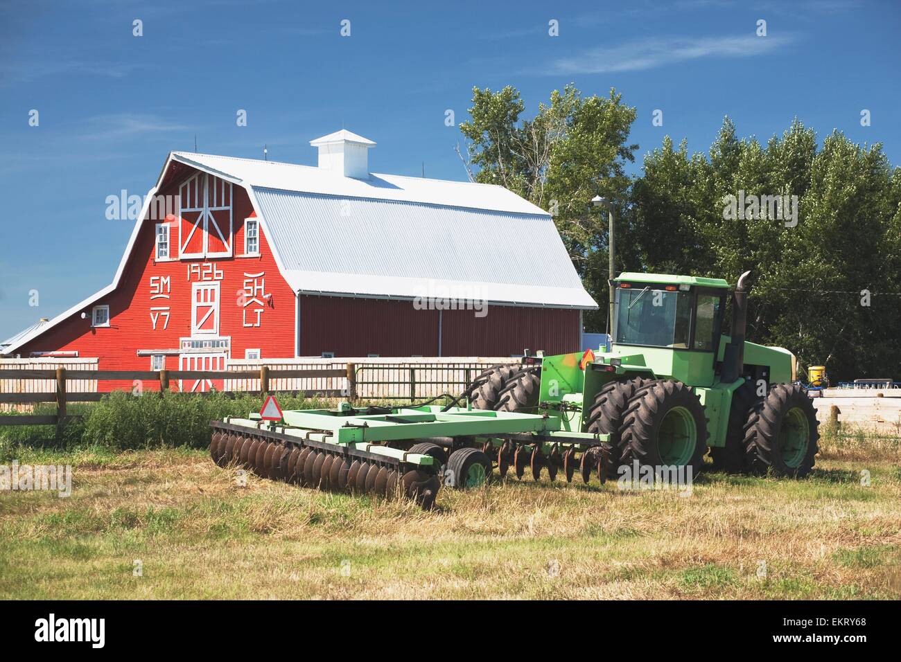 Red Barn And Tractor, Central Alberta, Canada Stock Photo - Alamy