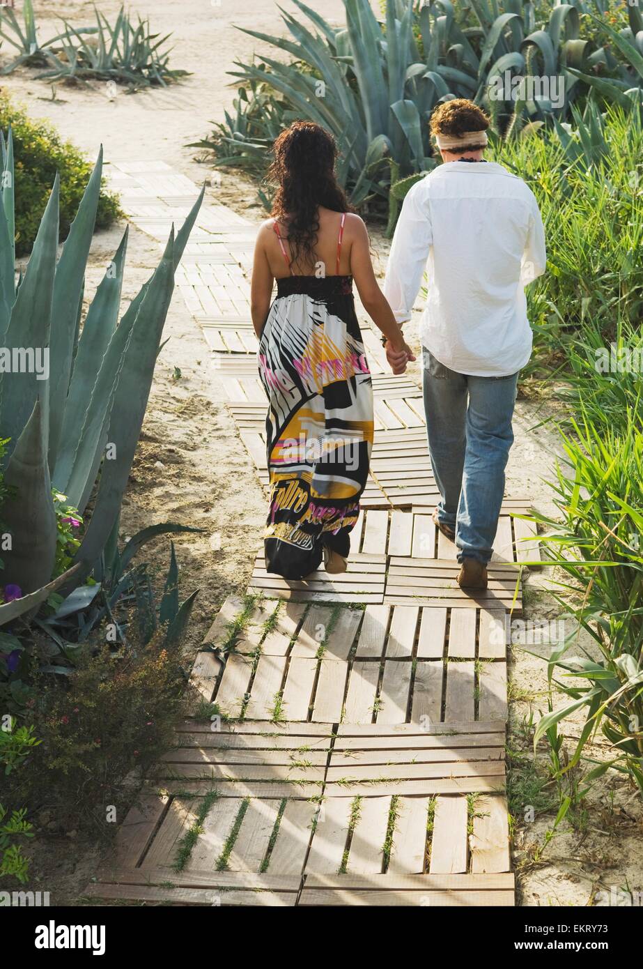 Couple Walking Down A Path Stock Photo - Alamy