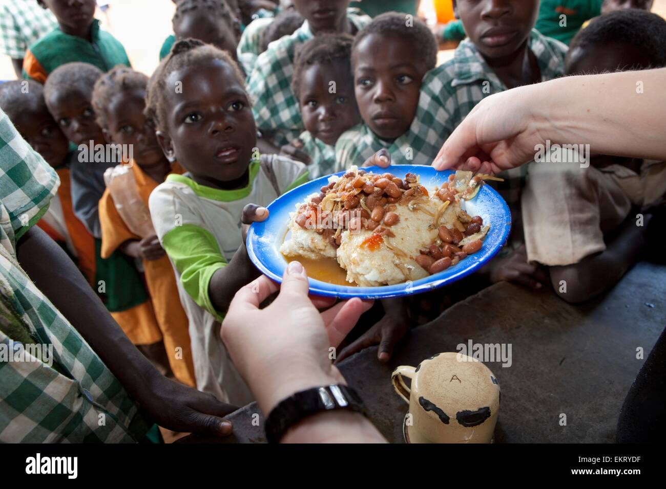 Children Being Served A Meal At School; Manica, Mozambique, Africa ...