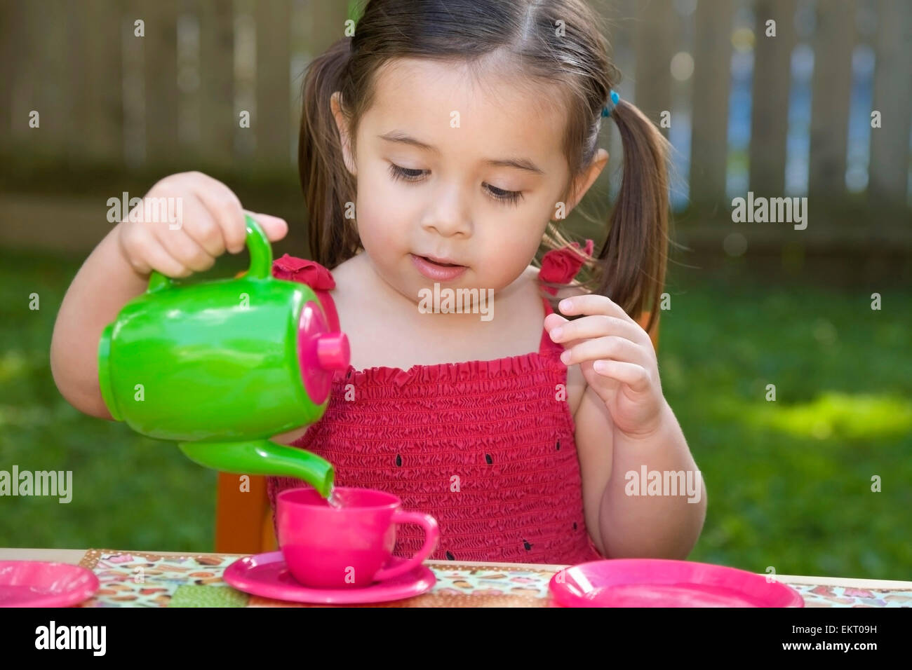 Young Chinese-Canadian Girl Pouring Tea, Ontario Stock Photo - Alamy