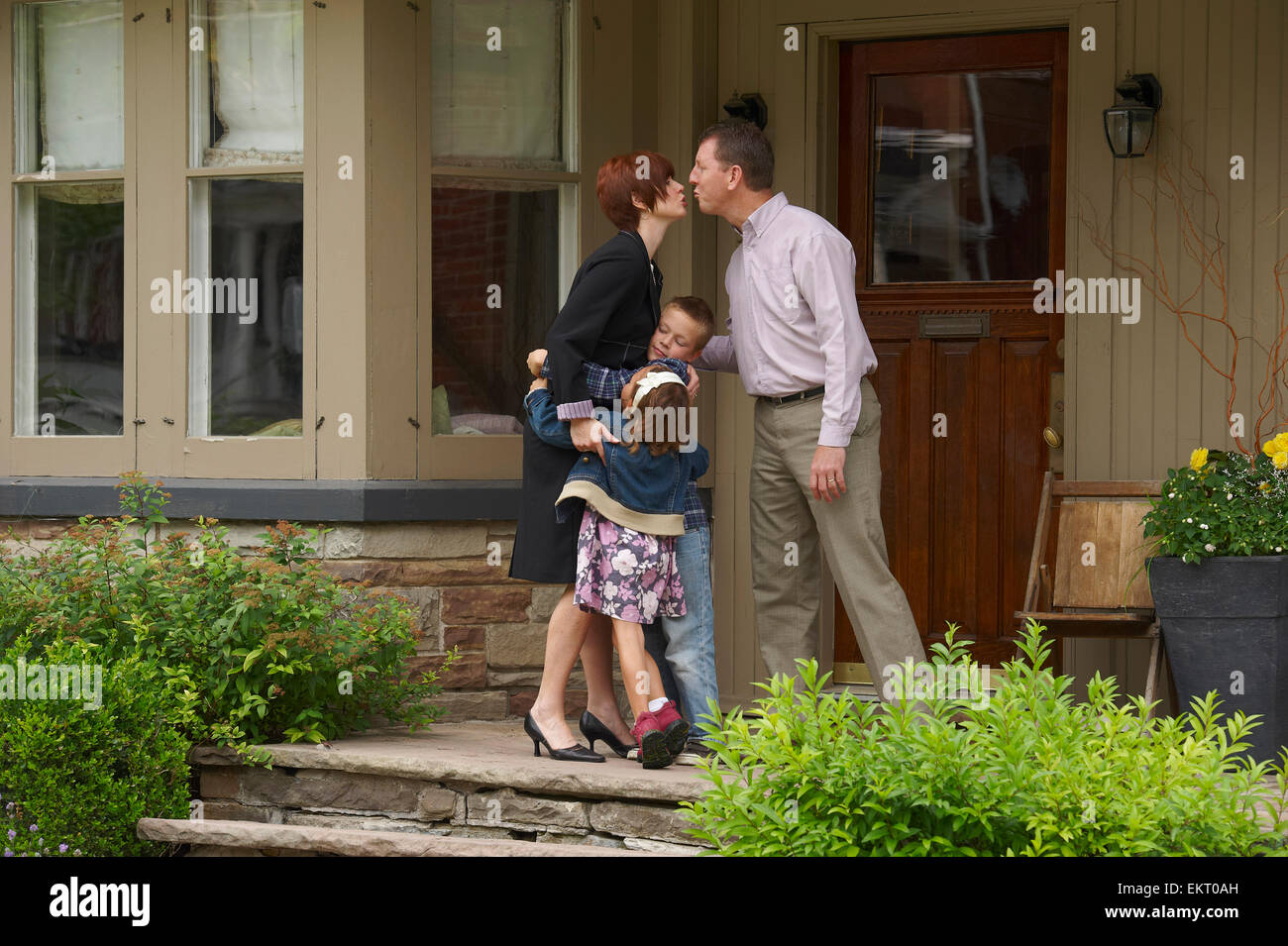 Family Leaving For Work And School, Saying Goodbye Stock Photo - Alamy