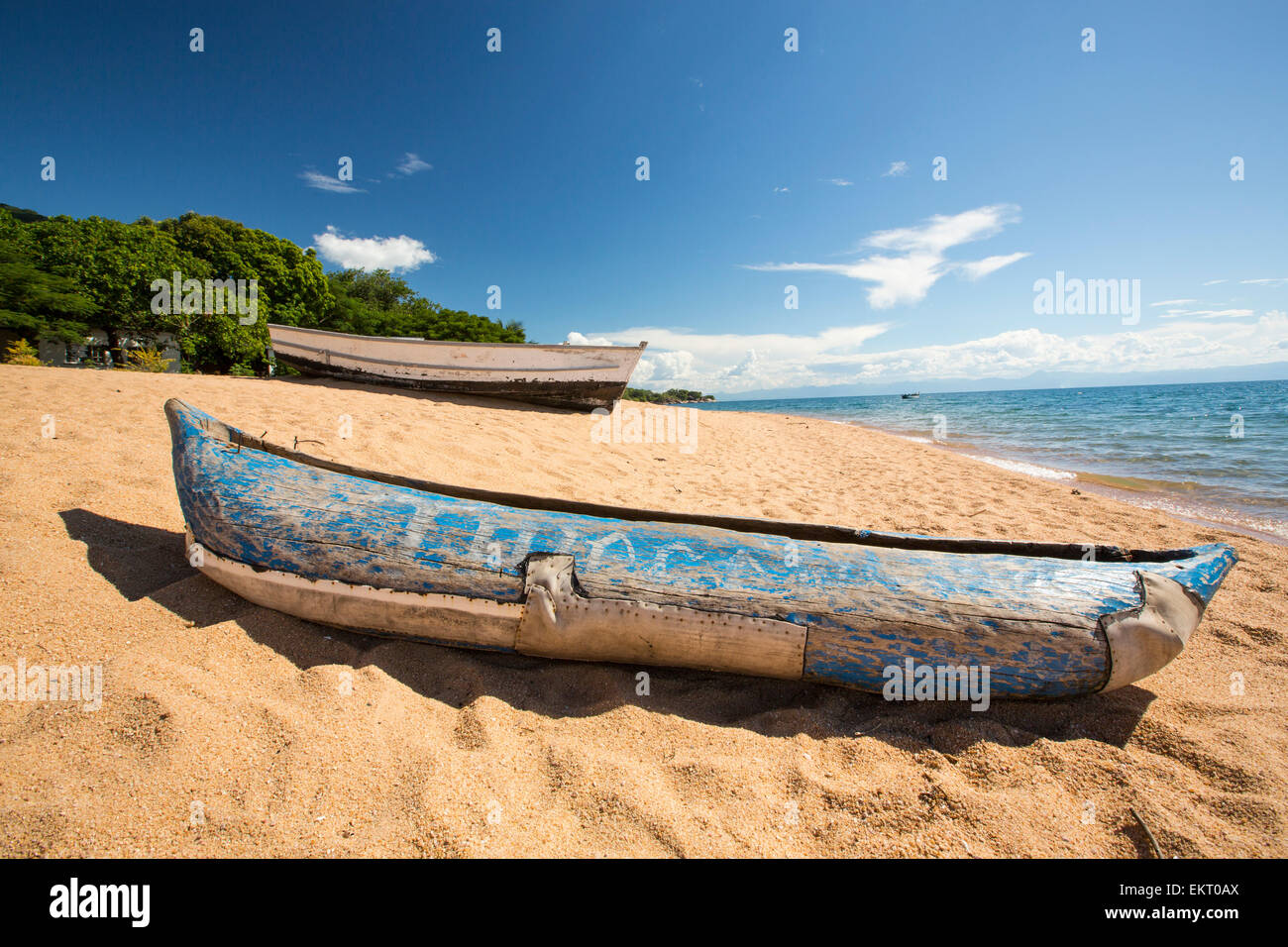 A traditional dug out canoe on a beach at Cape Maclear on the shores of ...