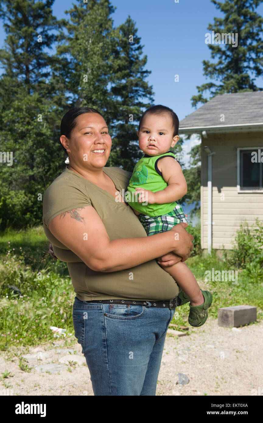 Native American Mother With Her Son Standing Outside In Front Of A Home ...